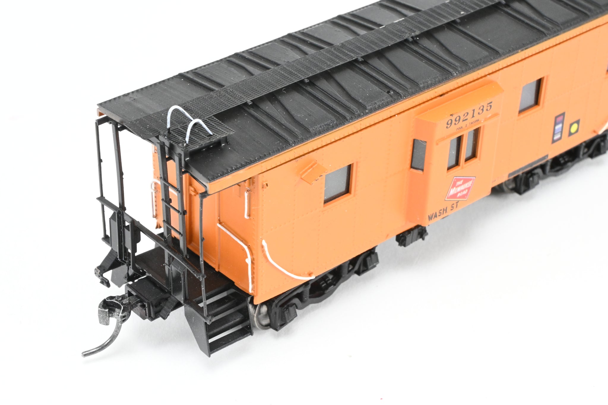 HO CON Lines West MILW - Milwaukee Road Thrall Bay Window Caboose Cust – ReSourced Rails